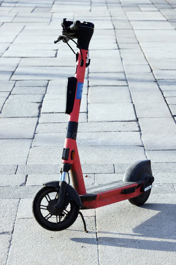Red Electric Scooter Parked in the City. Stock Photo - Image of gears ...