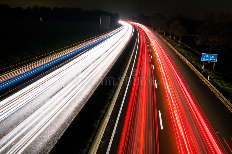 Motorway at Night with Fast Moving Cars Stock Image - Image of clouds ...