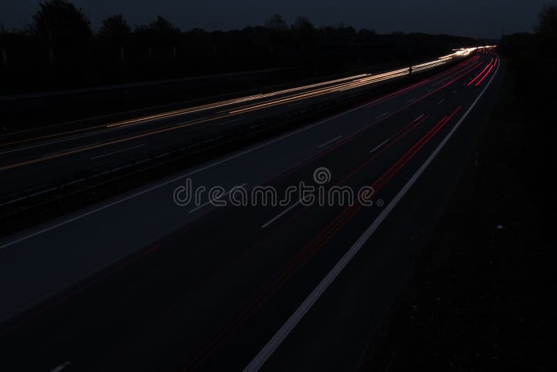 Motorway at Night with Fast Moving Cars Stock Image - Image of speed ...