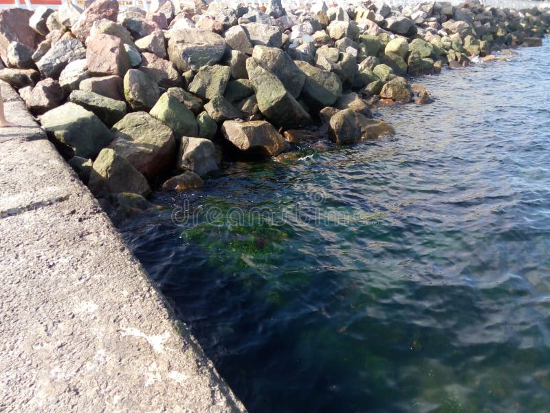 The Mound of Large Stones on the Sea Coast Near Water Stock Image ...