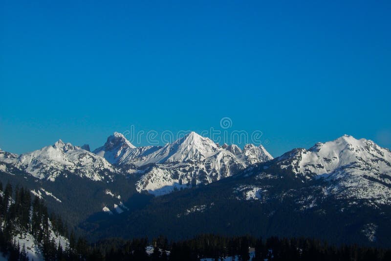 Snow Covered Mountain Under Blue Sky Mount Baker National Forest, North Cascades Stock Photo ...
