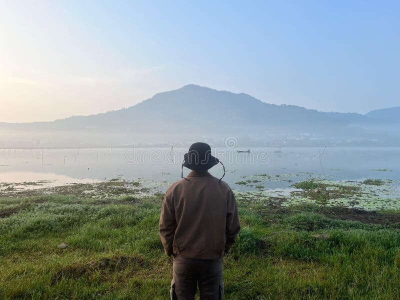 Mount Batur and blue lake stock image. Image of danau - 351474743