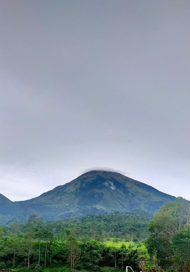 Mount Dieng Surrounded by Cloudy Atmosphere Stock Photo - Image of ...
