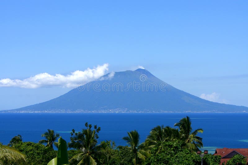 Mount Gamalama Over the Horizon Stock Image - Image of terrain, lake ...
