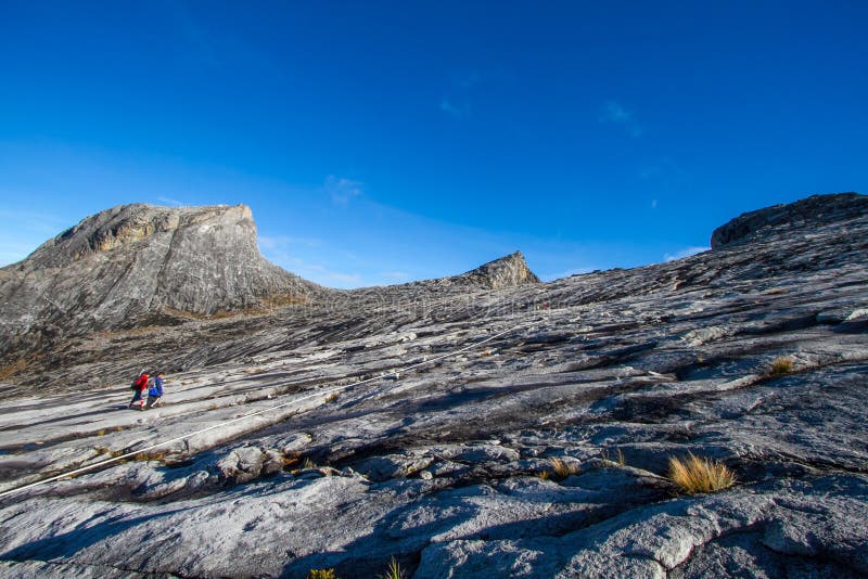 Mount Kinabalu Summit with Hikers in Silhouette Stock Photo - Image of ...