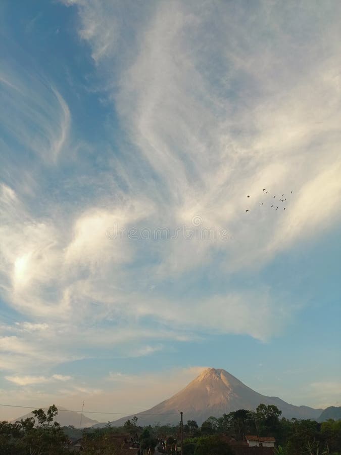 Merapi Mountain with Bird Flying Around at Afternoon Stock Image ...