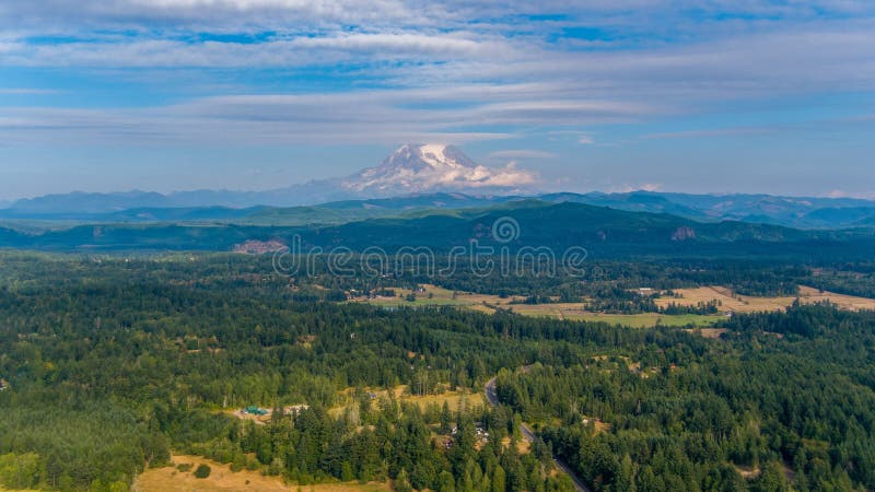 Mount Rainier on the Horizon in August Stock Photo - Image of rocks ...