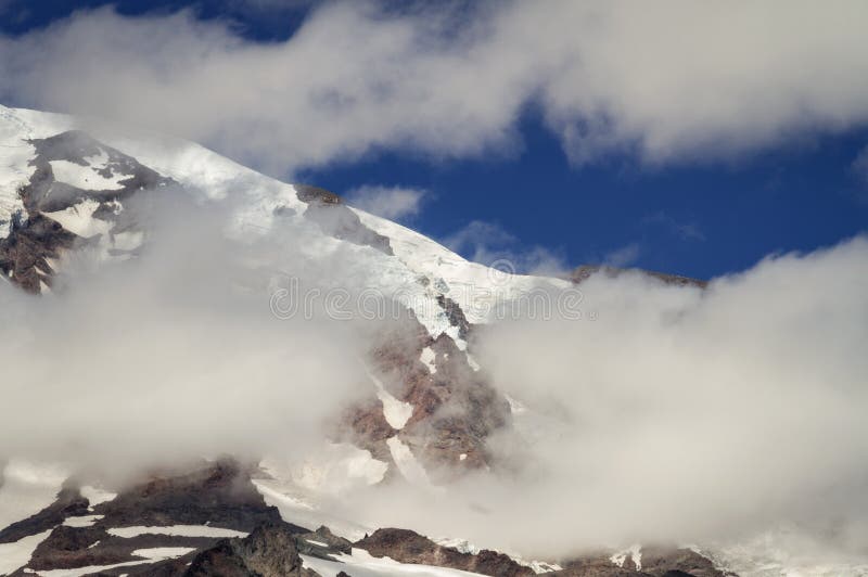 Clouds Roll Over Mount Rainier Stock Photo - Image of breeze, nature ...