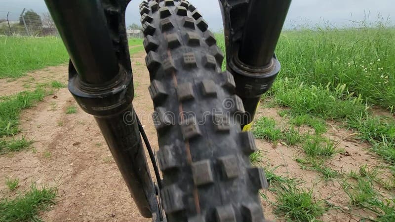 Mountain Bike Wheel Turning on the Road Stock Footage - Video of ...