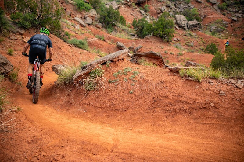 Mountain Biker Navigating a Dirt Trail in a Scenic Outdoor Setting with ...