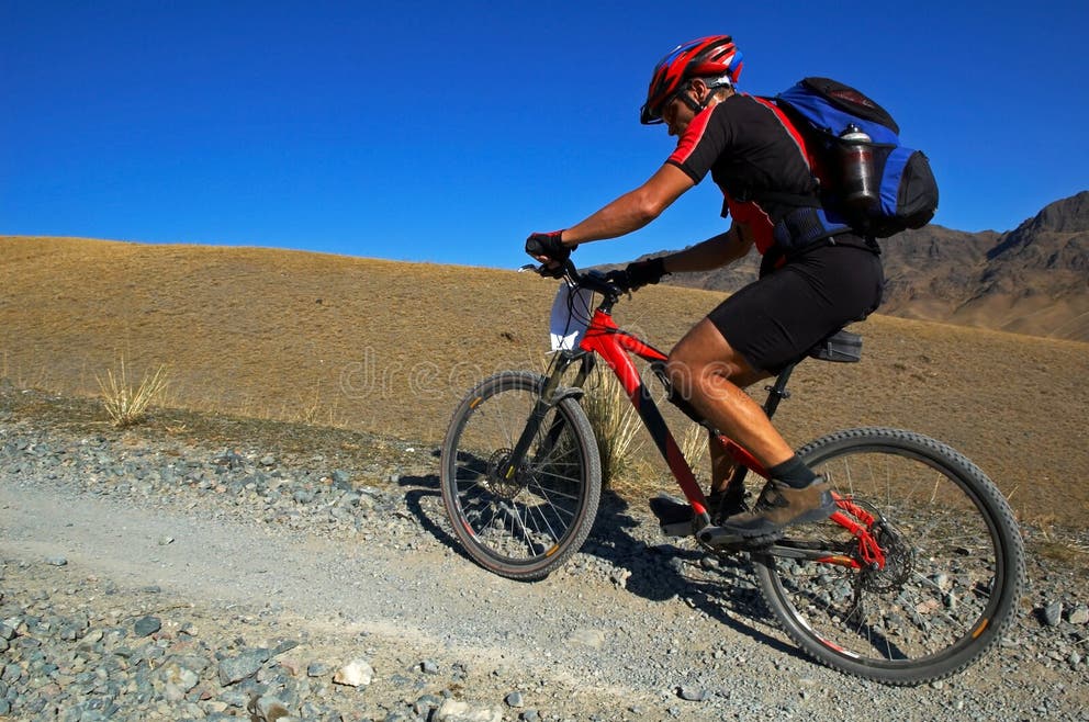 Mountain Biker Racing in Desert Stock Image - Image of racing, fast ...