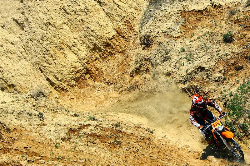 Mountain Biker Rides a Motorcycle Down the Mountain Stock Photo - Image ...