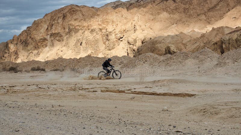 Mountain biker in a desert stock photo. Image of biker - 29192728