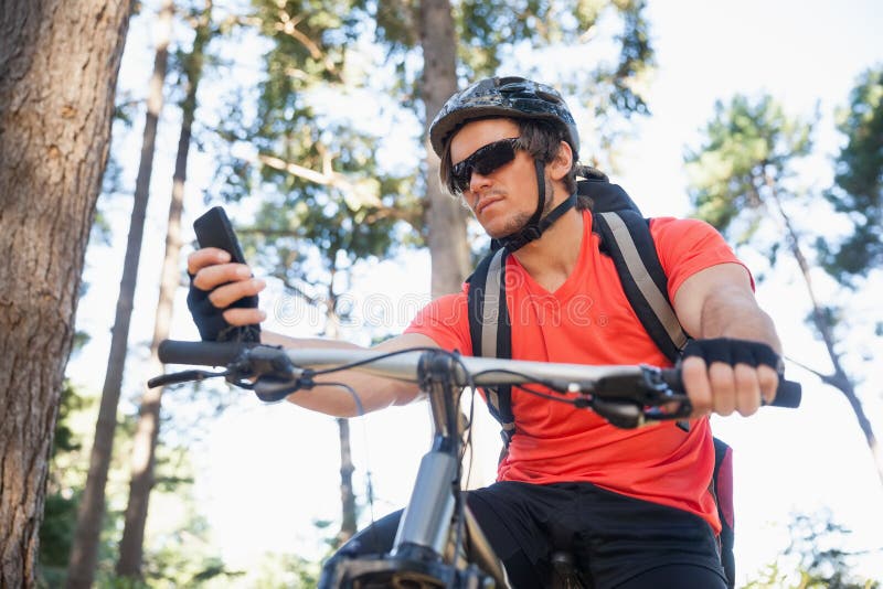 Mountain Biker Using Mobile Phone Stock Photo - Image of countryside ...