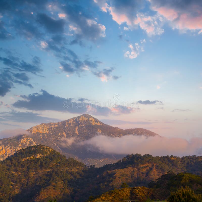 Mountain Chain in Clouds at the Evening Stock Photo - Image of stone ...