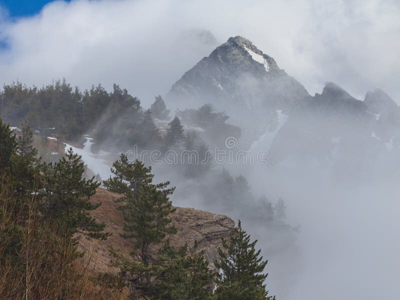 Mountain Chain in a Mist and Dense Clouds Stock Photo - Image of haze ...