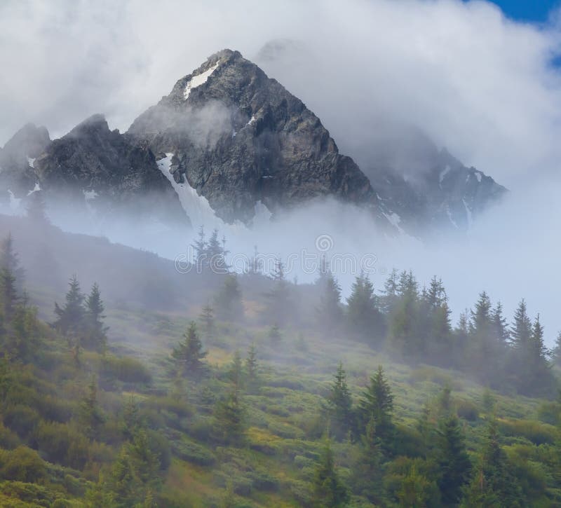 Mountain Chains in Dense Mist and Clouds Stock Image - Image of mist ...