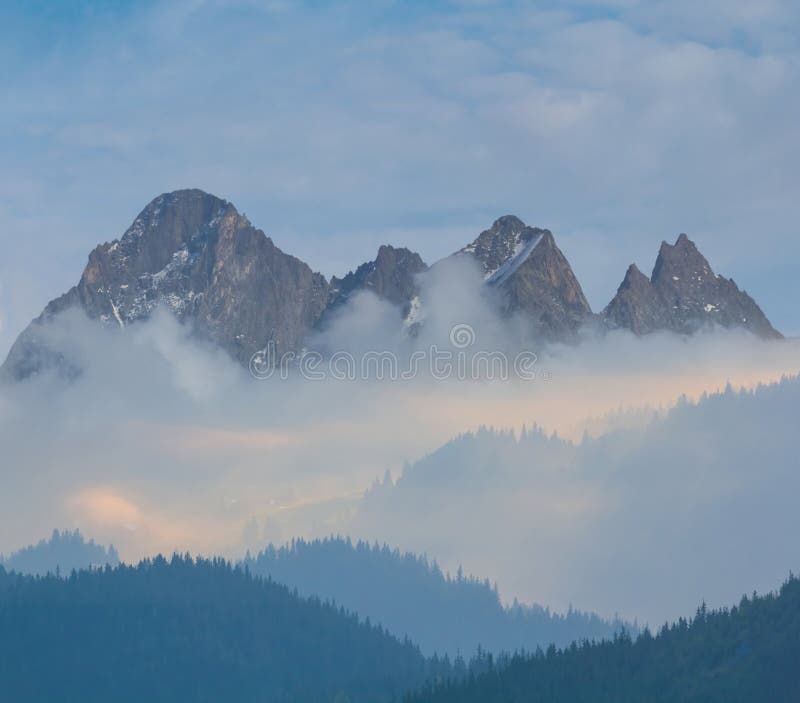 Mountain Chains in Dense Mist and Clouds Stock Image - Image of ...