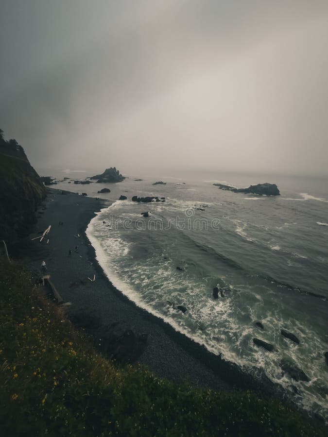 Mountain Cliff Near the Ocean with Big Waves Stock Image - Image of ...