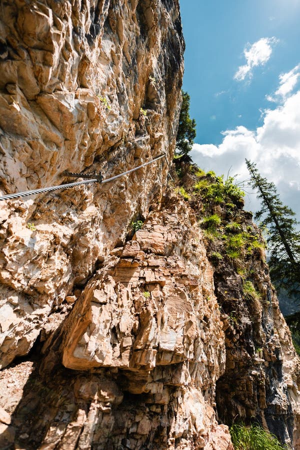 Mountain Cliff with a Steel Wire Cable Leading Up a Climbing Path Stock ...