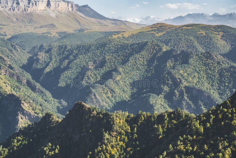 Mountain Cliffs with a Forest of Deciduous Trees and Mountain Ranges in ...