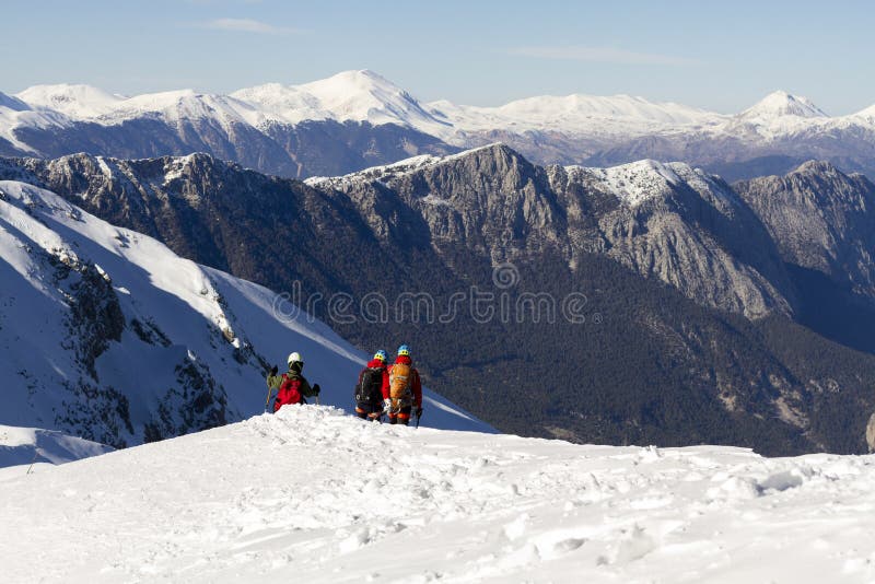 3 Mountain Climbers Walk on Snow in Mountains Stock Image - Image of ...