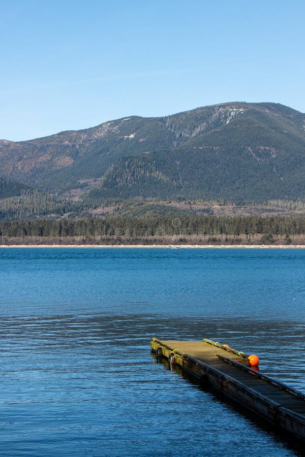 Dock with Mountain Coastal View Stock Image - Image of island, sunny ...