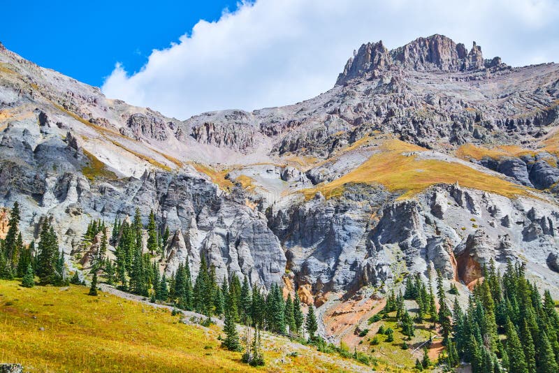 Mountain with Columns of Gray Rock and Sharp Peaks with Pine Trees at ...