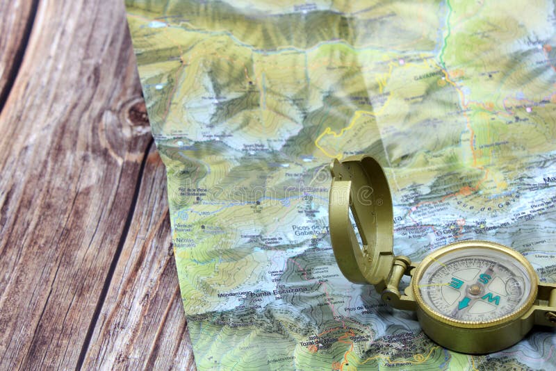 Mountain Compass on a Cartographic Map Stock Image - Image of compass ...