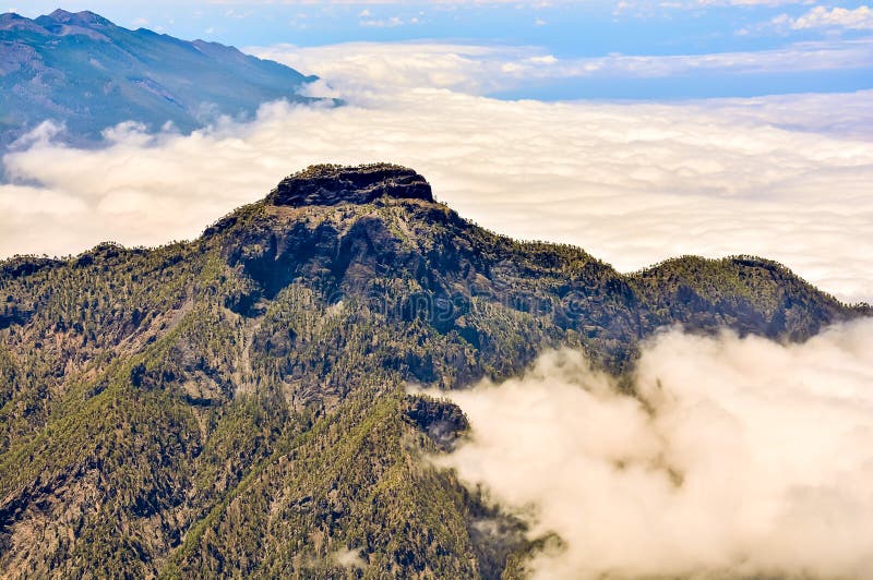 A Mountain Covered in Trees and Clouds Stock Image - Image of beautiful ...