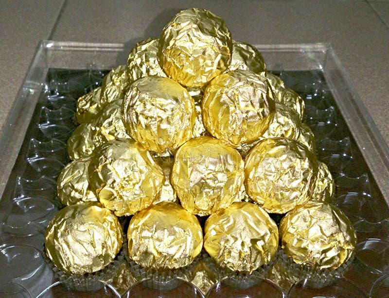 A Mountain of Golden Foil Wrappers Stock Photo - Image of wrappers ...