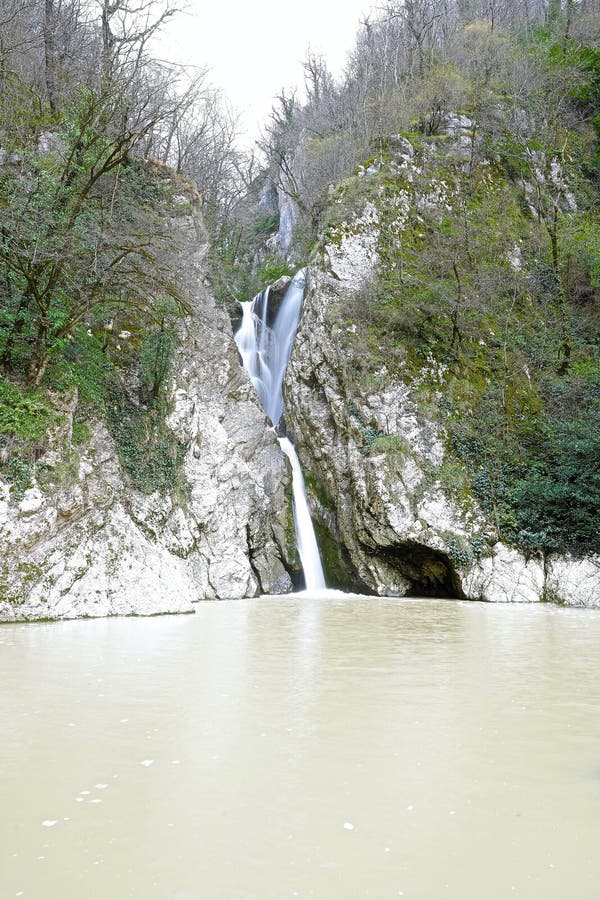 Waterfall in a Mountain Forest in Early Spring Stock Photo - Image of ...