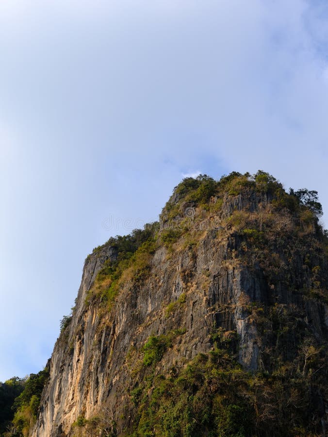 A Mountain with a Green Tree on it Stock Image - Image of outdoor ...