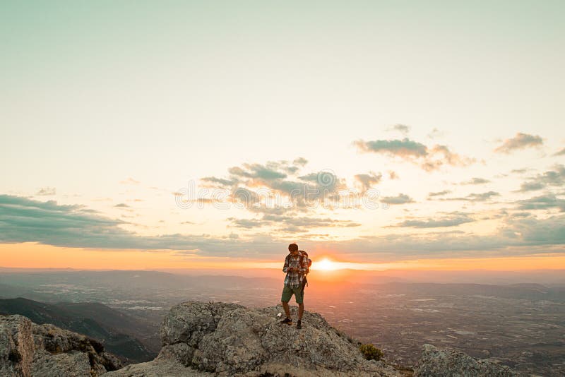 Mountain hiker at sunset stock image. Image of hike - 120891111