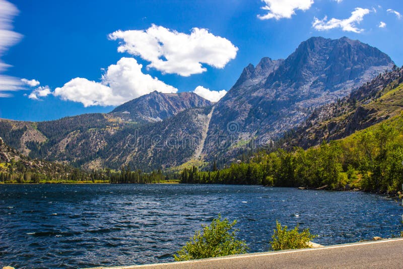 Mountain Lake at Base of Mountain Range Stock Image - Image of peaceful ...