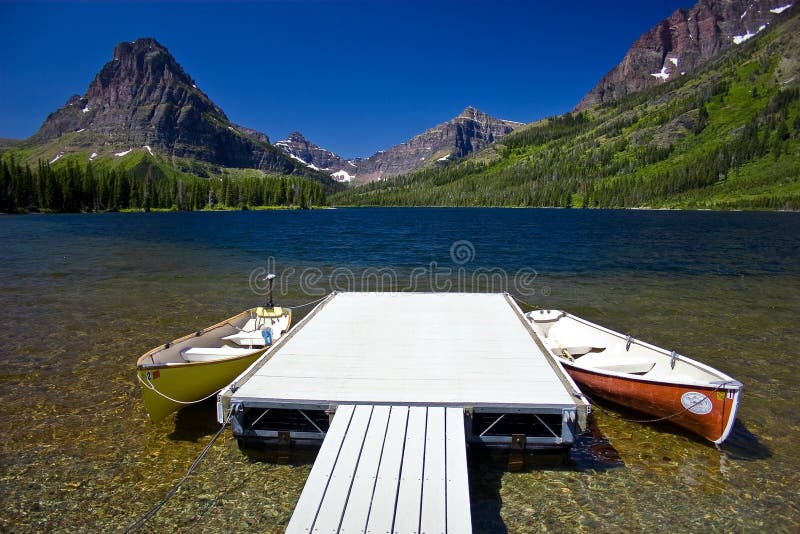 Mountain Lake with Canoes and Dock Stock Photo - Image of park, seasons ...