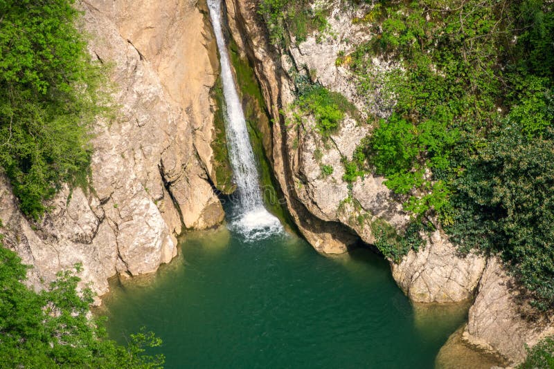 Mountain Lake and High Waterfall Flowing into it Stock Photo - Image of ...
