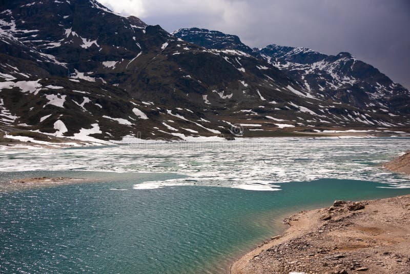 Mountain Lake with Ice in Switzerland in Spring Stock Photo - Image of ...