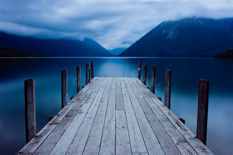 Mountain lake with a jetty stock photo. Image of landscape - 19672392