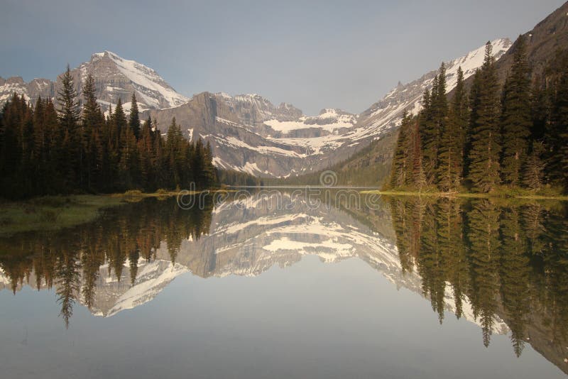 Mountain lake reflection stock image. Image of park, snow - 25192733
