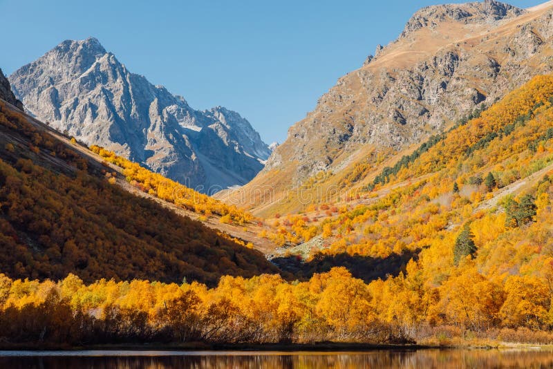 Mountain Lake in Valley with Colorful Autumnal Fall Trees and Mountains ...