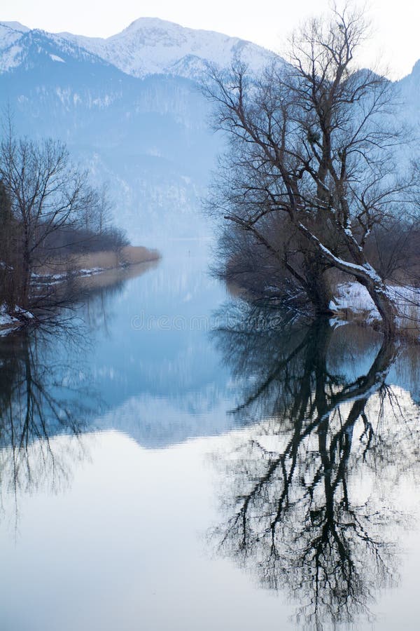 Mountain Lake in Winter, Trees with Reflection in Calm Water Stock ...