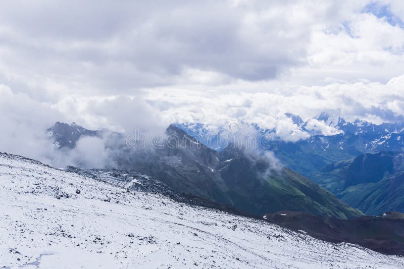 Mountain Landscape, View from High Mountain Snow Slope To Cloud Covered ...