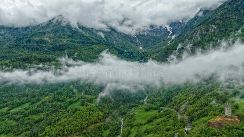 Mountain Landscape, White Clouds Over Green Alps Mountains Stock Image ...