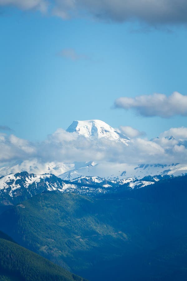 Mountain Peak Above Clouds stock photo. Image of capped - 95543228