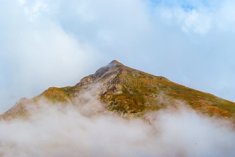 Mountain Peak among the Clouds Stock Image - Image of shaped, altitude ...