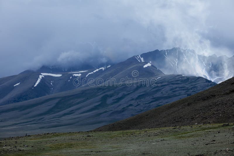 Mountain Peaks Covered in Snow and a Fantastic Volcano with Steam Cloud ...