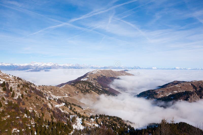 Mountain Peaks Emerging from the Clouds Stock Image - Image of emerging ...