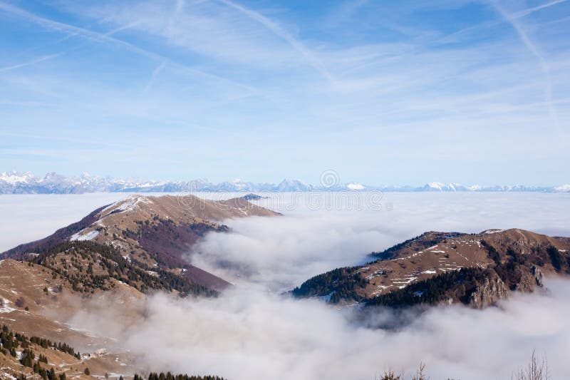 Mountain Peaks Emerging from the Clouds Stock Photo - Image of winter ...