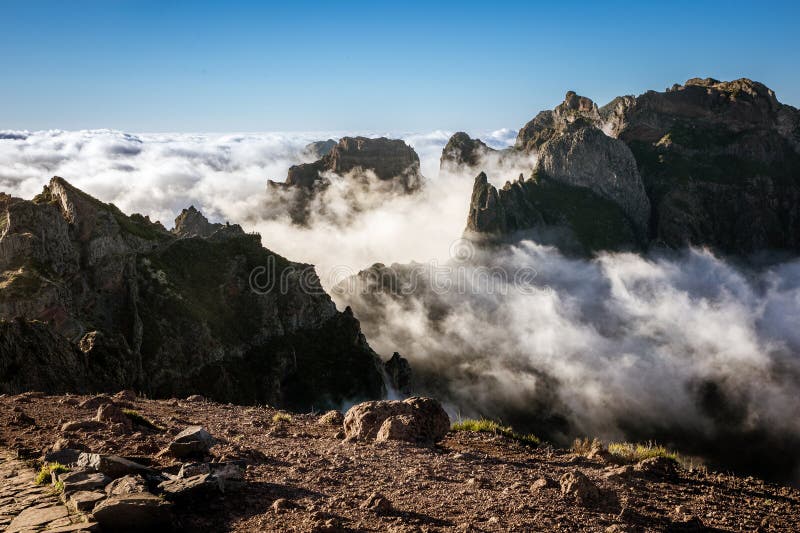 Mountain Pinnacles at Sunset. Clouds Below the Peaks. Stock Photo ...
